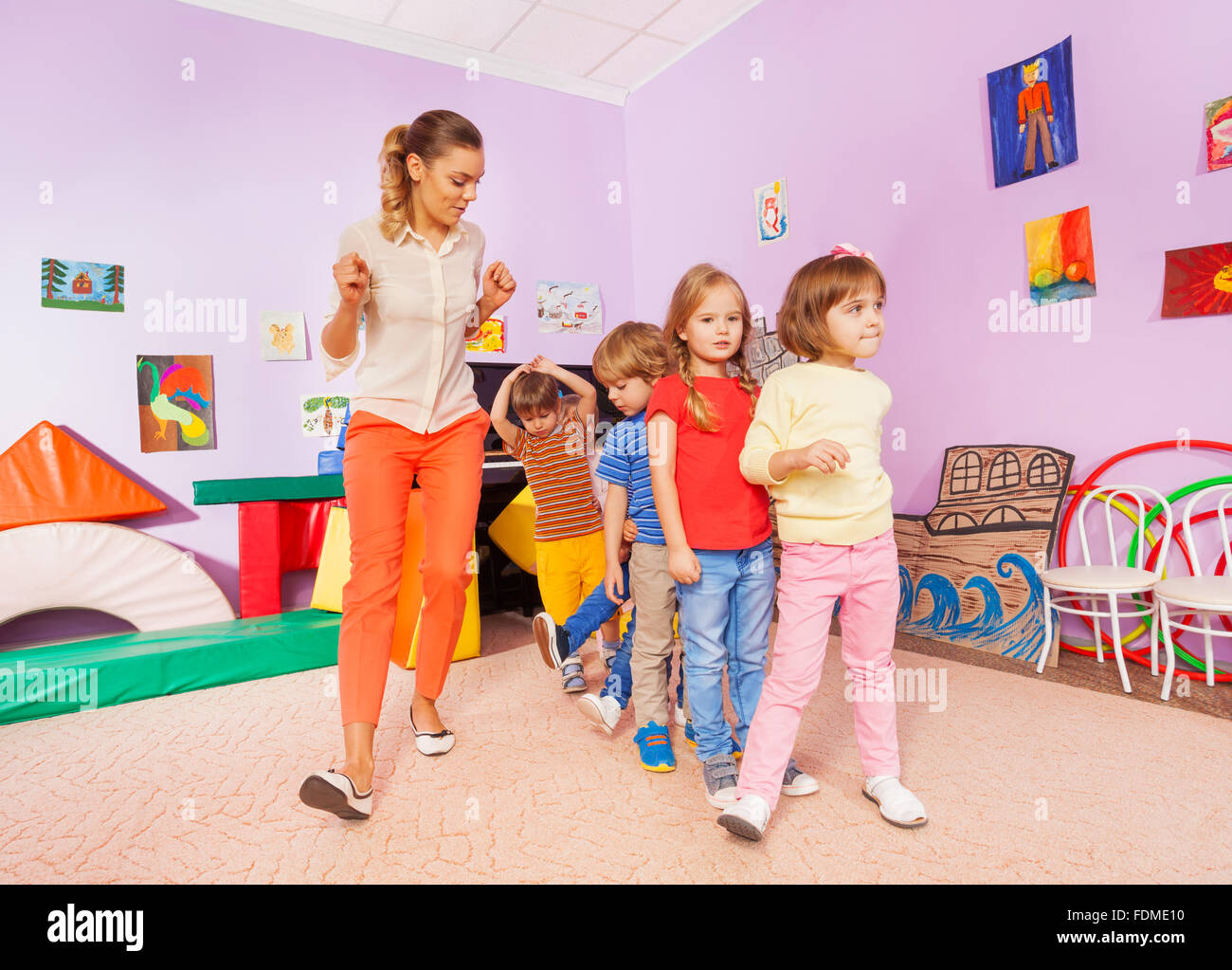 Dancing lesson with kids repeat after teacher Stock Photo - Alamy
