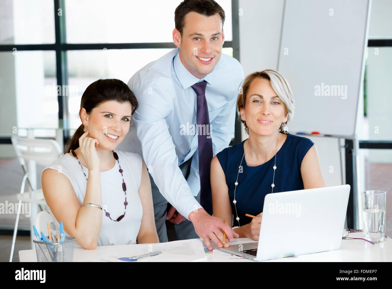 Team of business people working together Stock Photo - Alamy