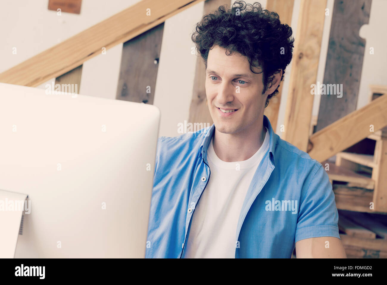 Man in casual wear working in office Stock Photo - Alamy
