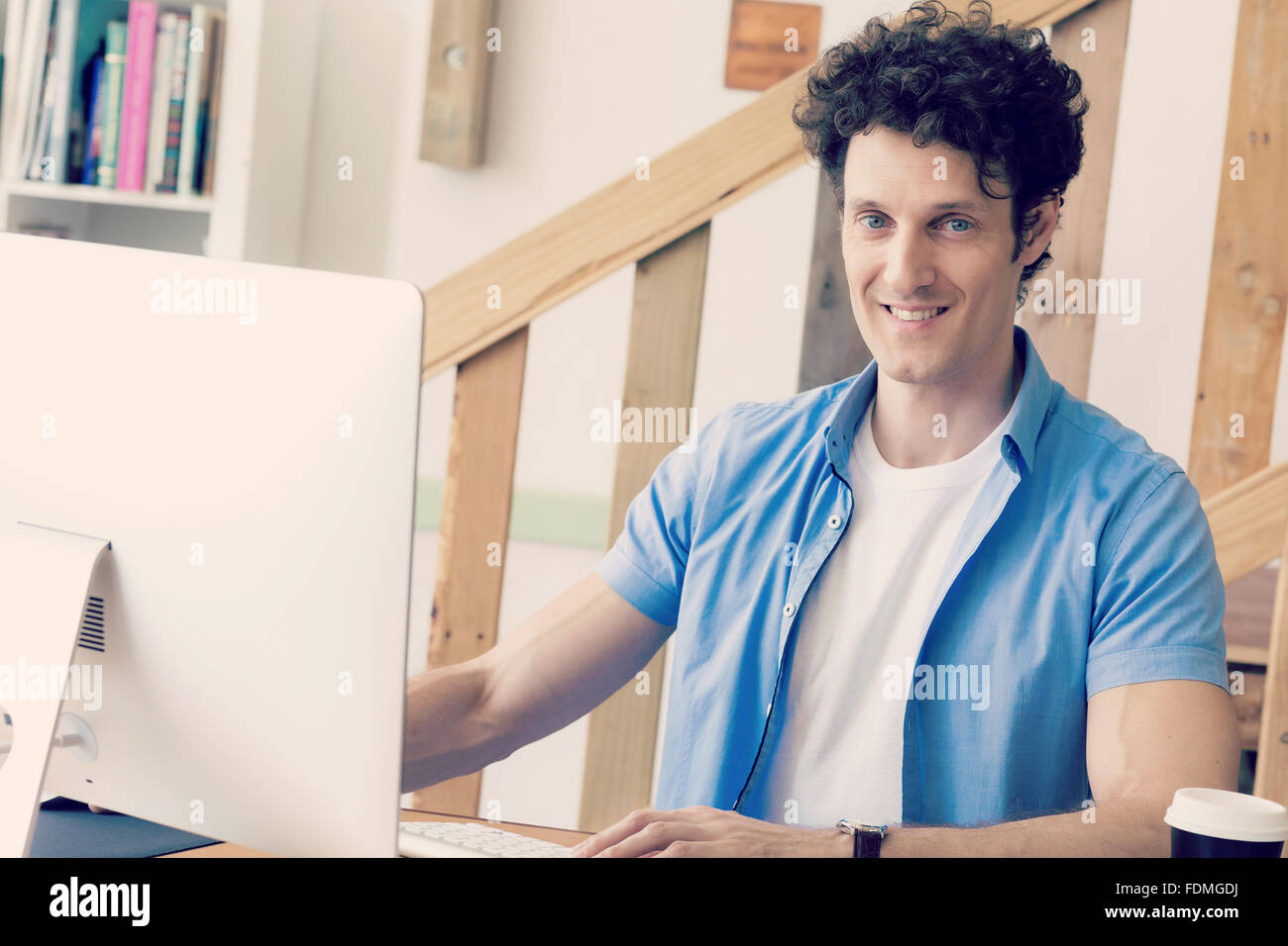 Man in casual wear working in office Stock Photo - Alamy
