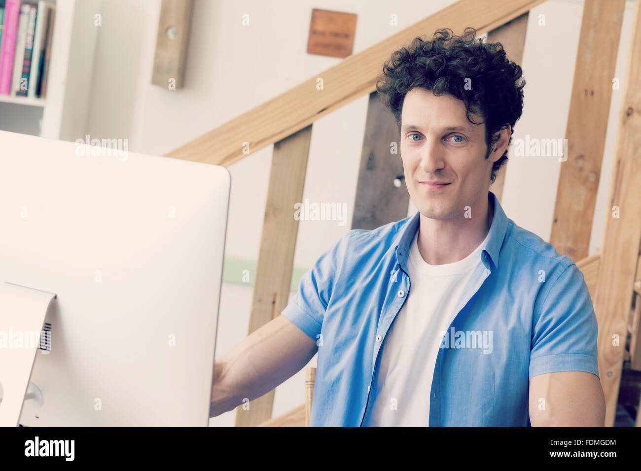 Man in casual wear working in office Stock Photo - Alamy