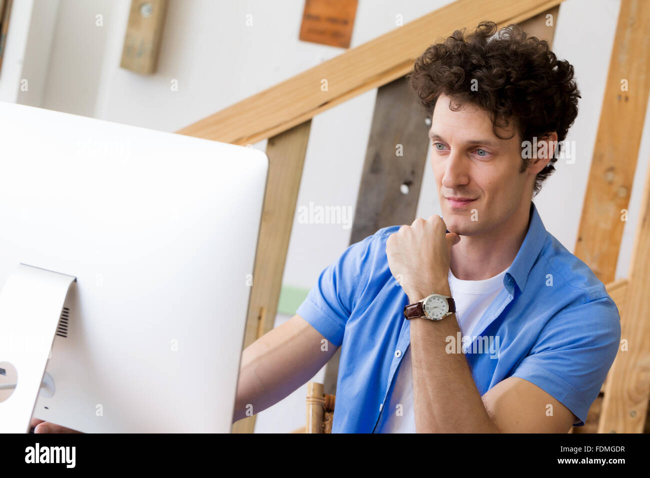 Man in casual wear working in office Stock Photo - Alamy