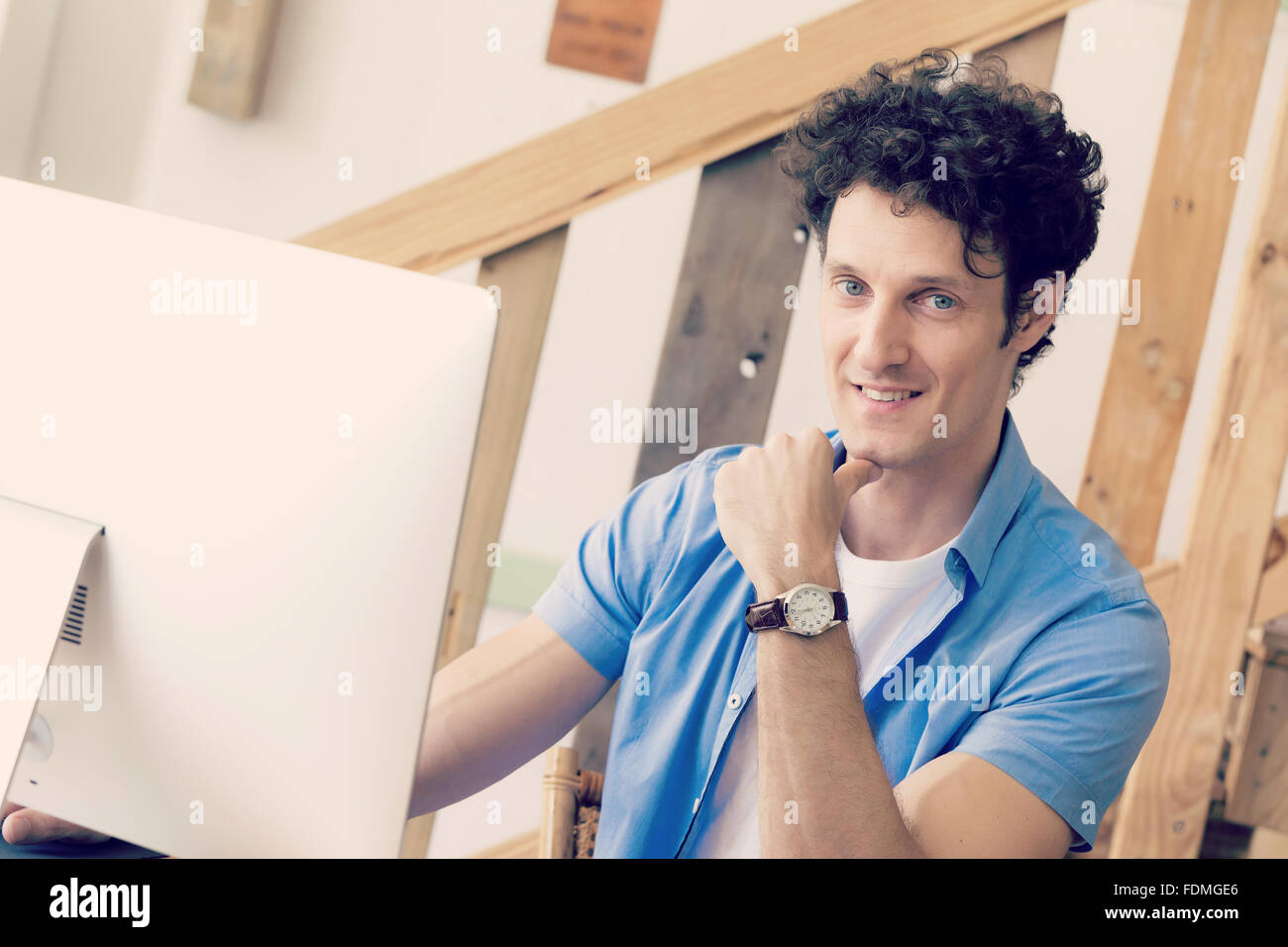 Man in casual wear working in office Stock Photo - Alamy