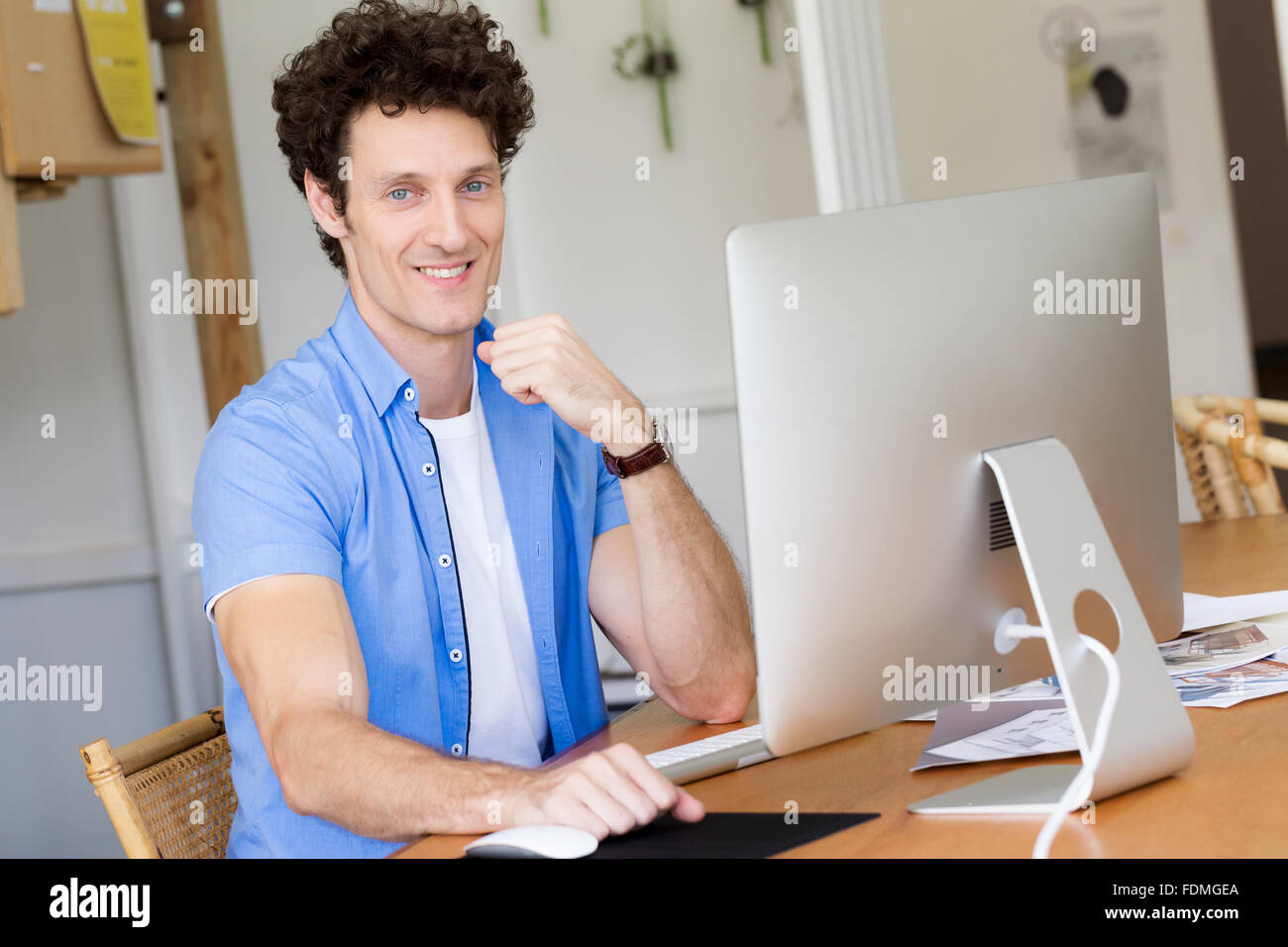 Man in casual wear working in office Stock Photo - Alamy