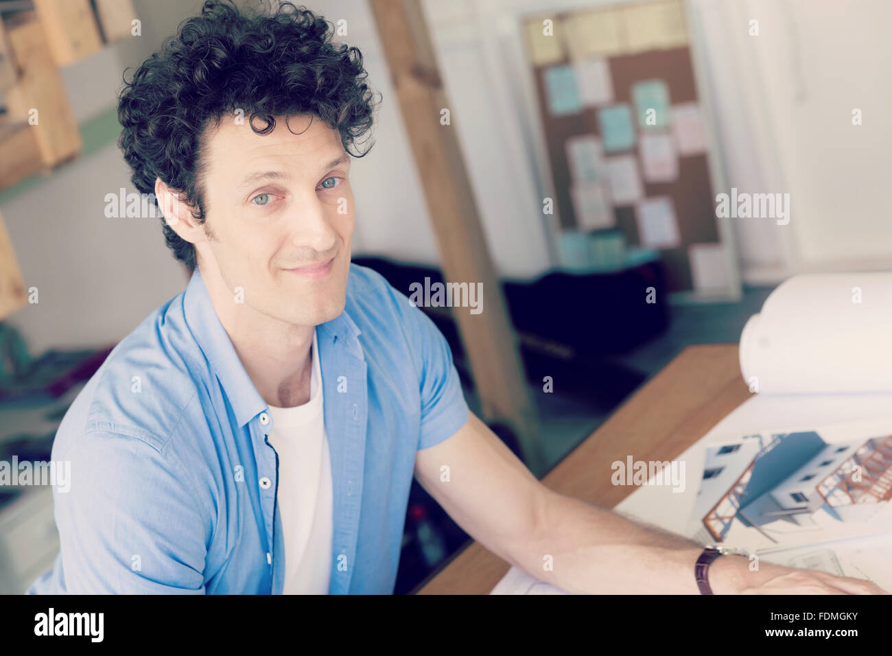 Man working with drafts in office Stock Photo - Alamy