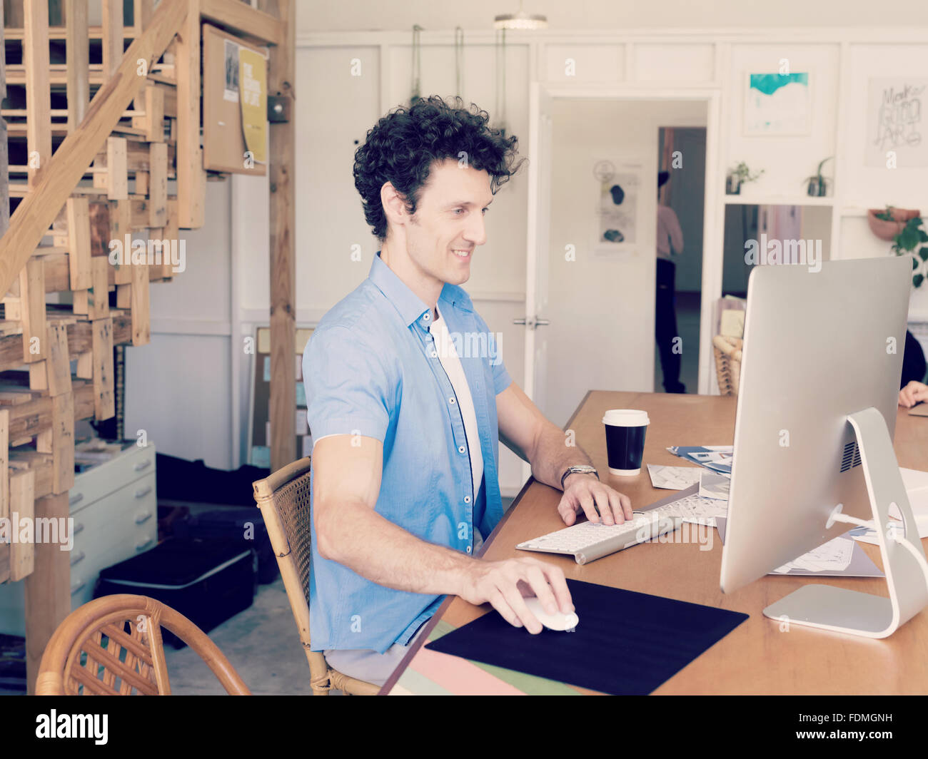 Man in casual wear working in office Stock Photo - Alamy