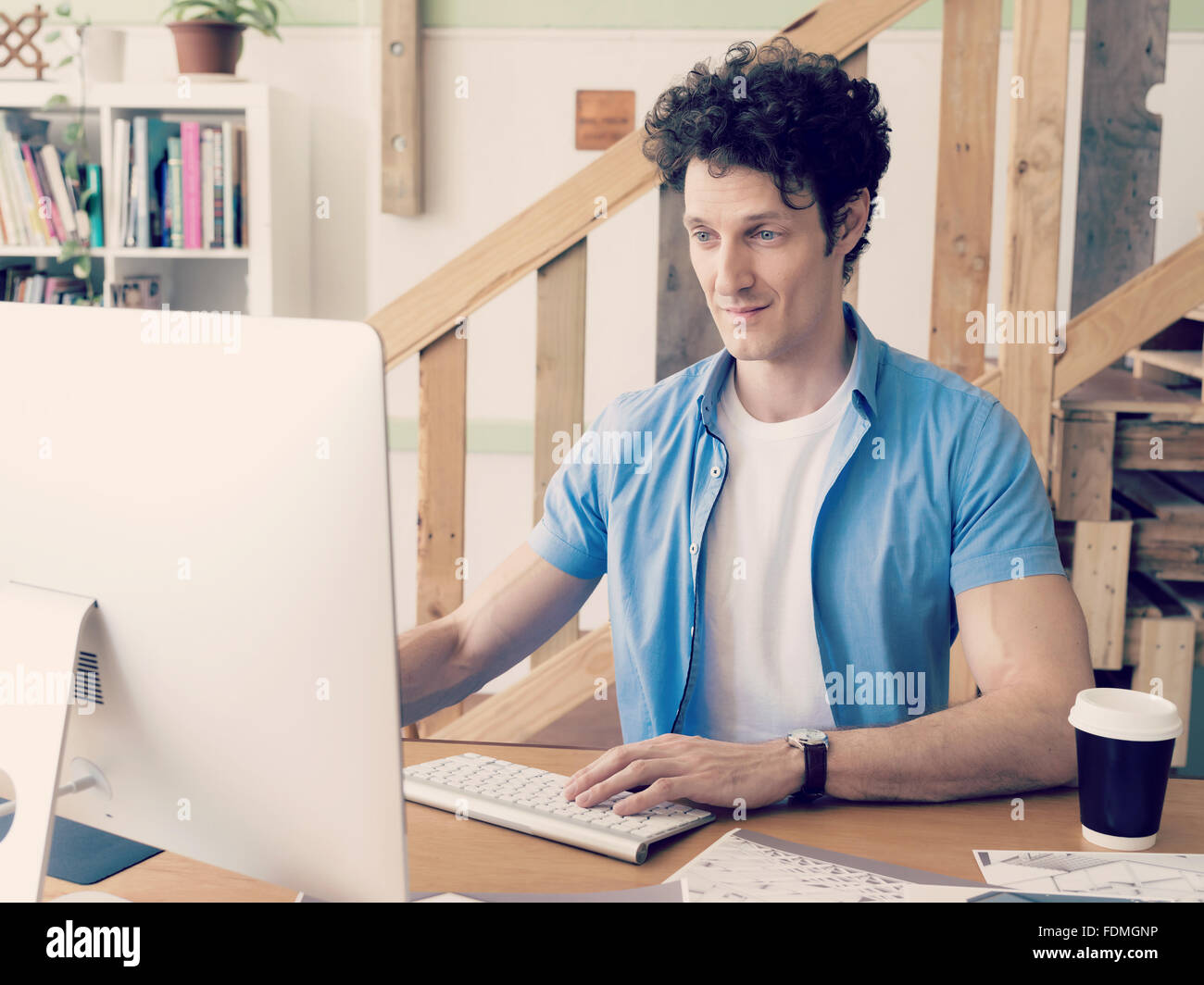 Man in casual wear working in office Stock Photo - Alamy