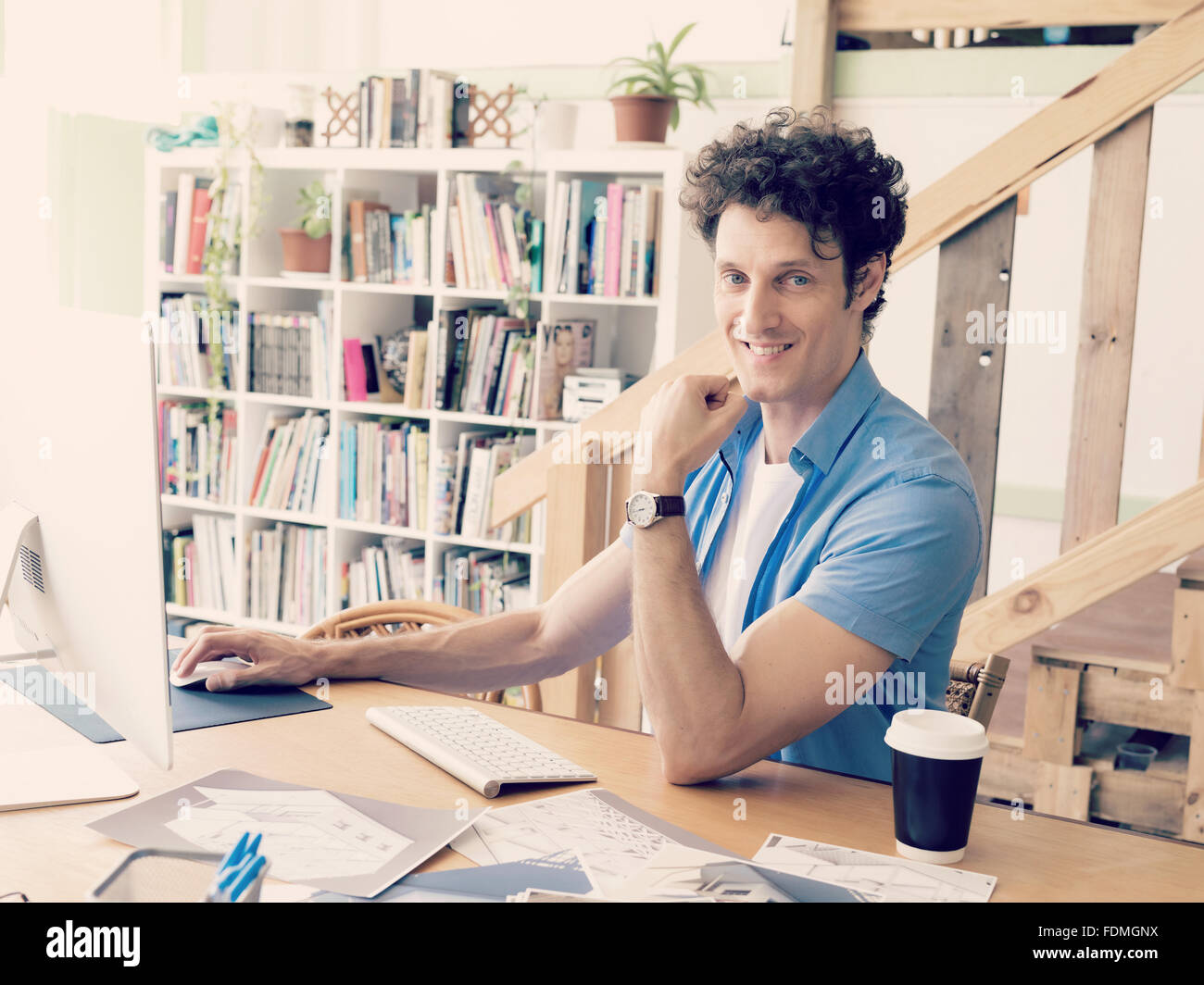 Man in casual wear working in office Stock Photo - Alamy