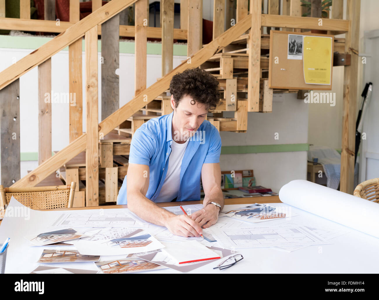 Man working with drafts in office Stock Photo - Alamy