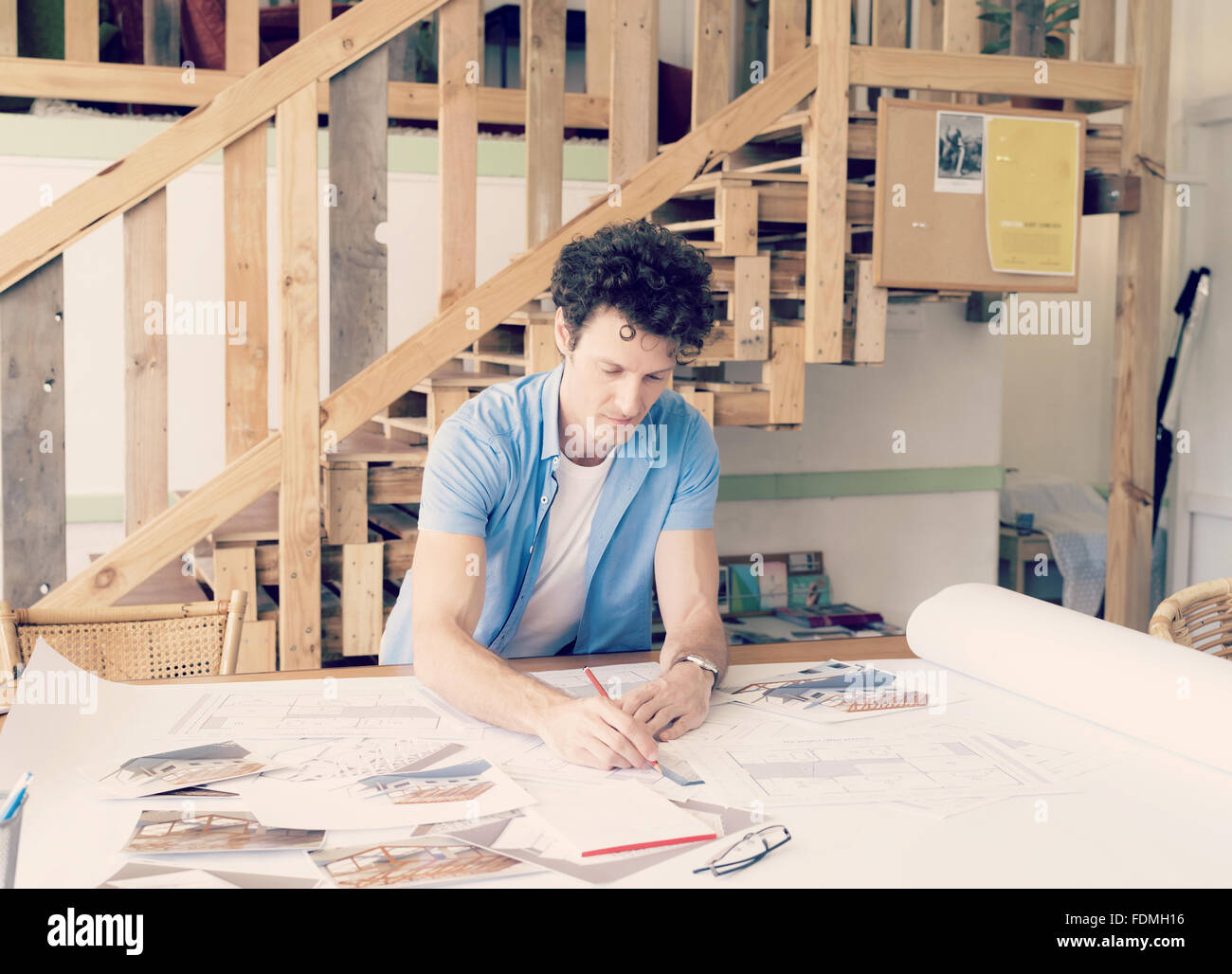 Man working with drafts in office Stock Photo - Alamy
