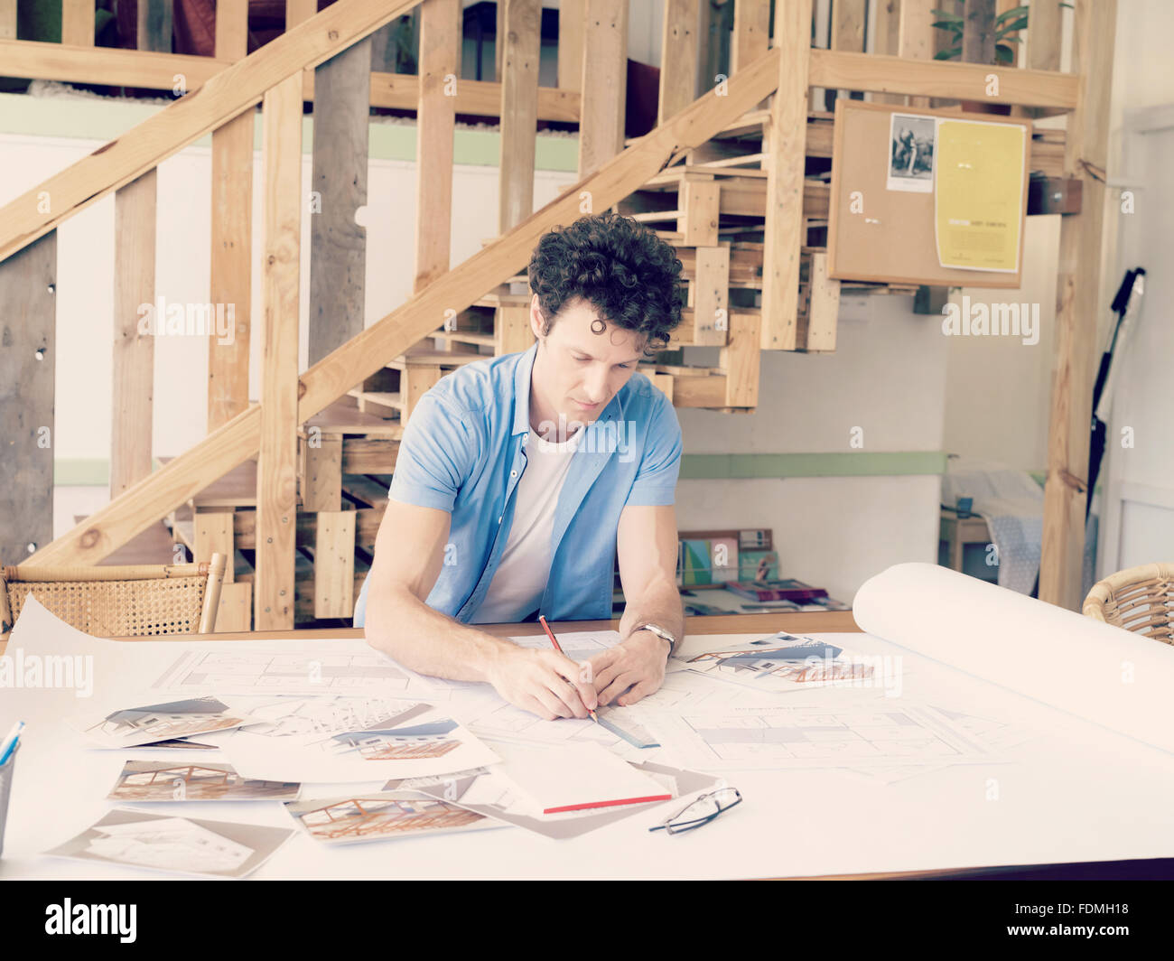 Man working with drafts in office Stock Photo - Alamy