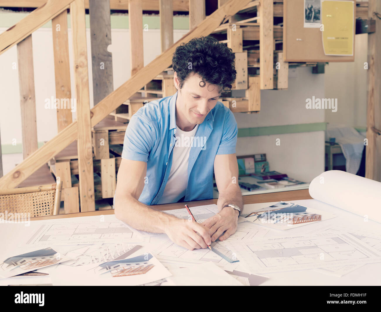 Man working with drafts in office Stock Photo - Alamy