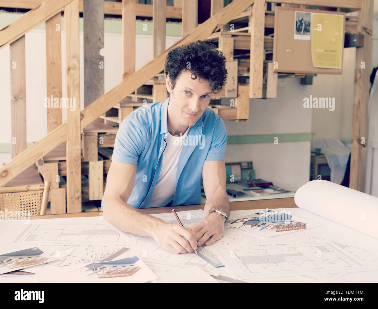 Man working with drafts in office Stock Photo - Alamy