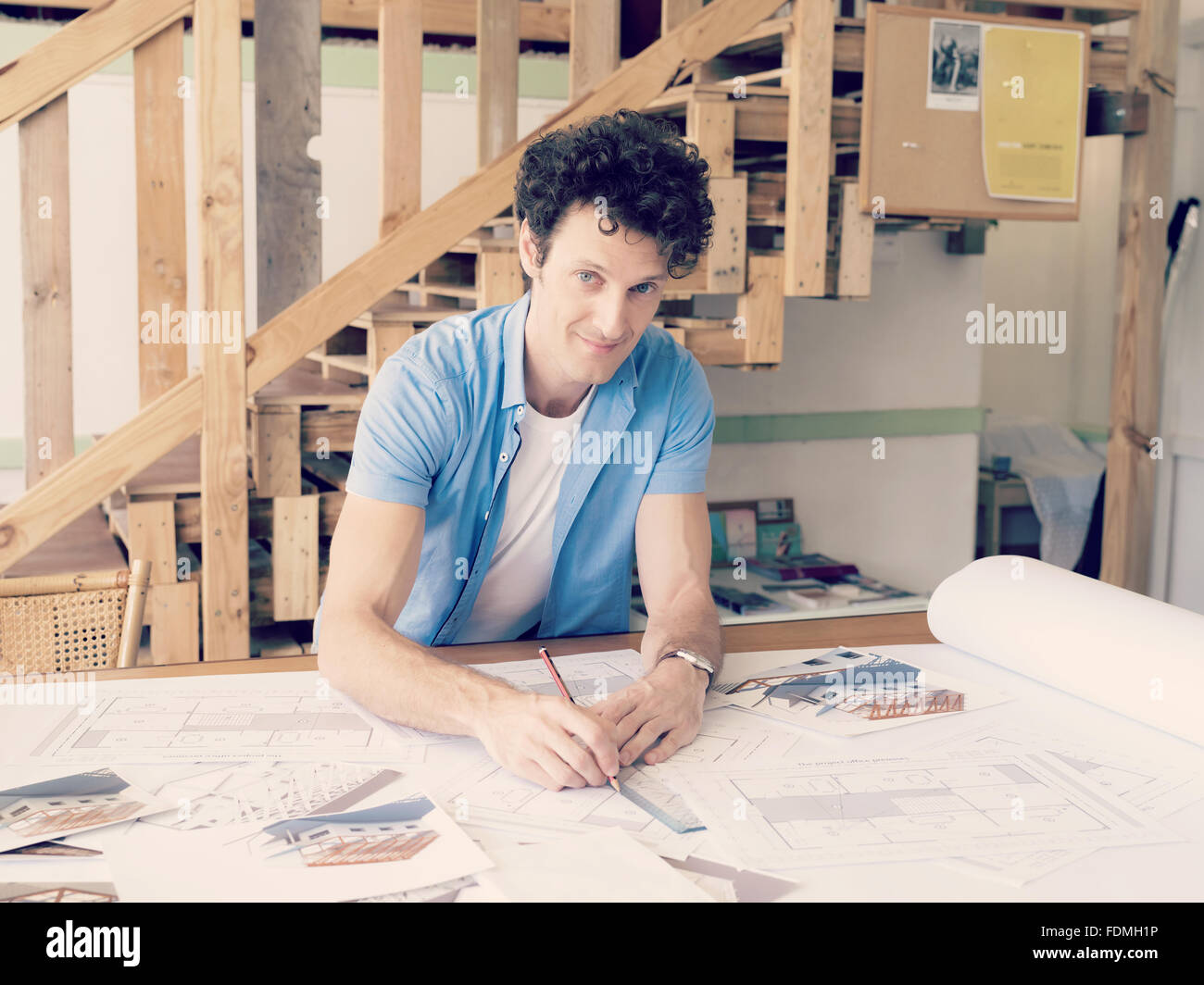 Man working with drafts in office Stock Photo - Alamy
