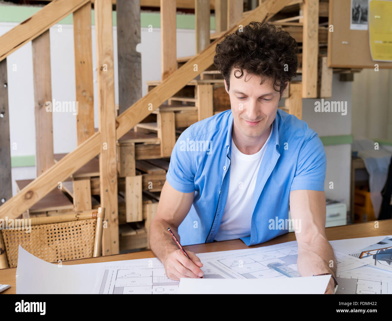 Man working with drafts in office Stock Photo - Alamy