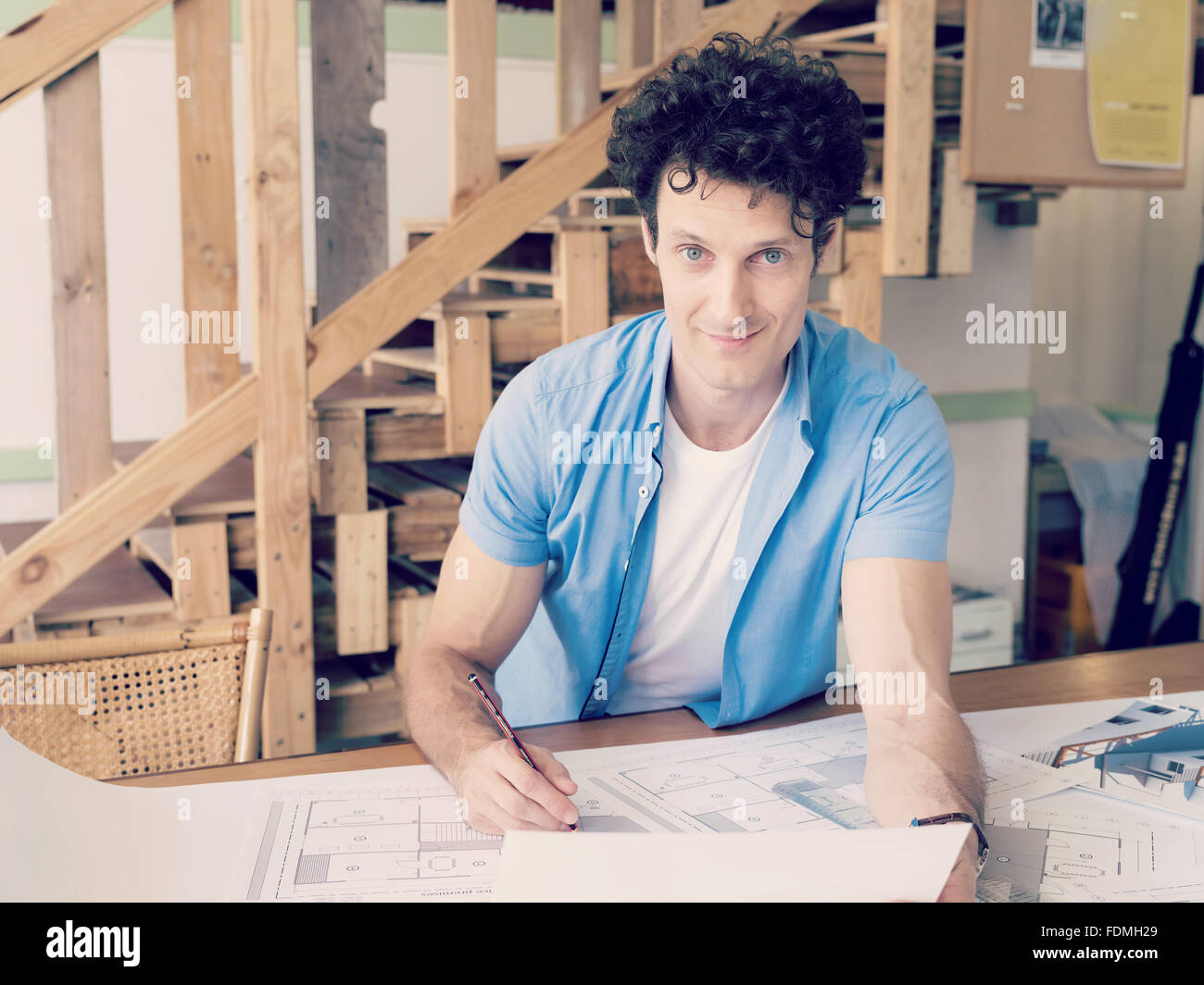 Man working with drafts in office Stock Photo - Alamy