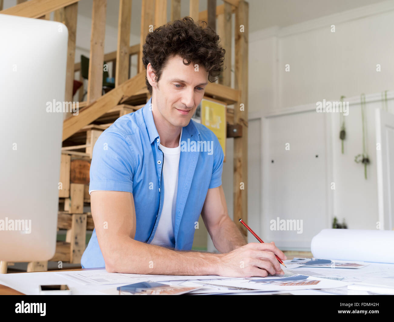 Man working with drafts in office Stock Photo - Alamy