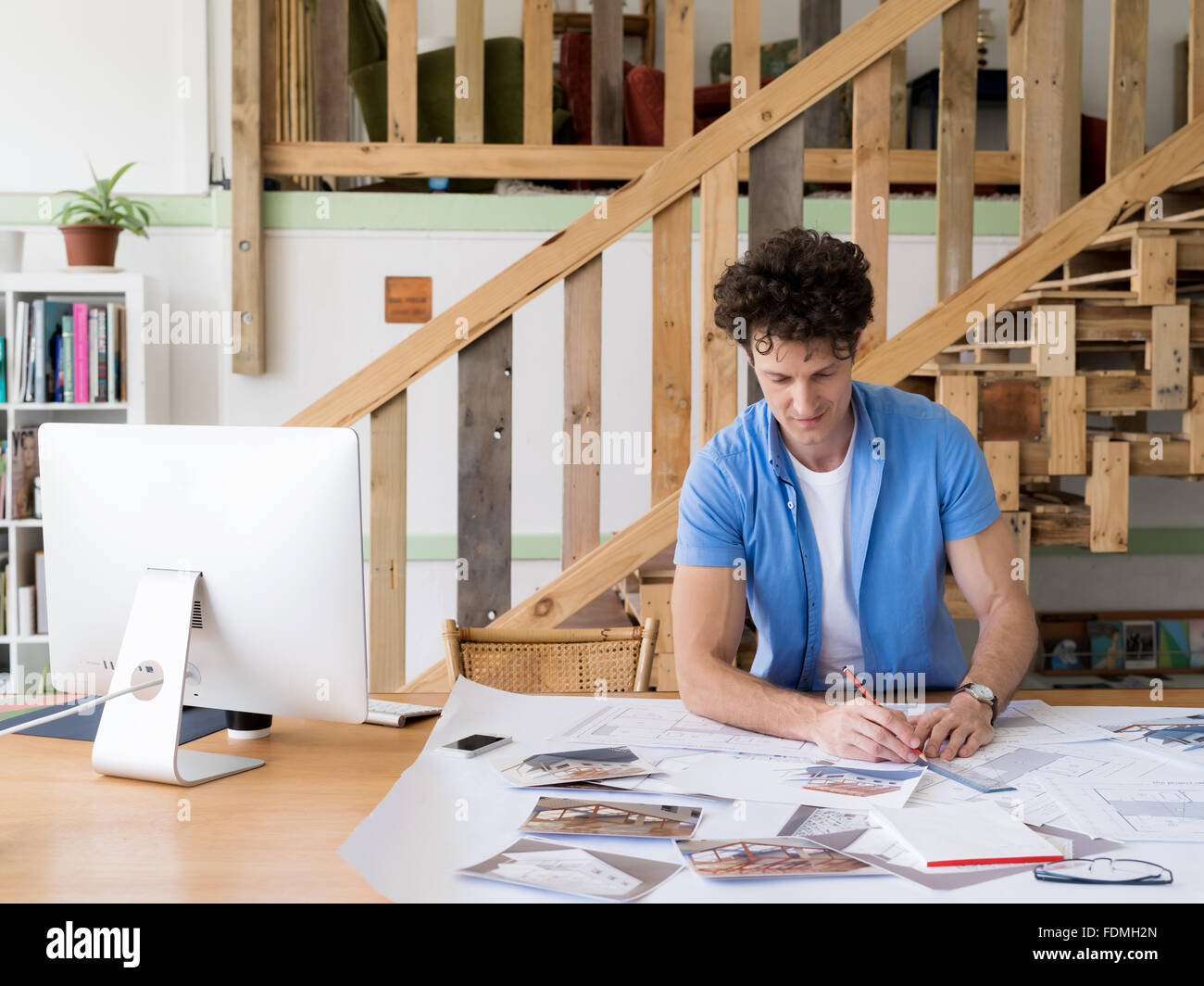 Man working with drafts in office Stock Photo - Alamy