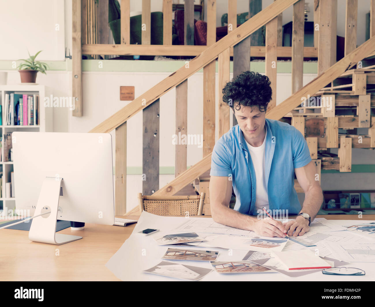 Man working with drafts in office Stock Photo - Alamy