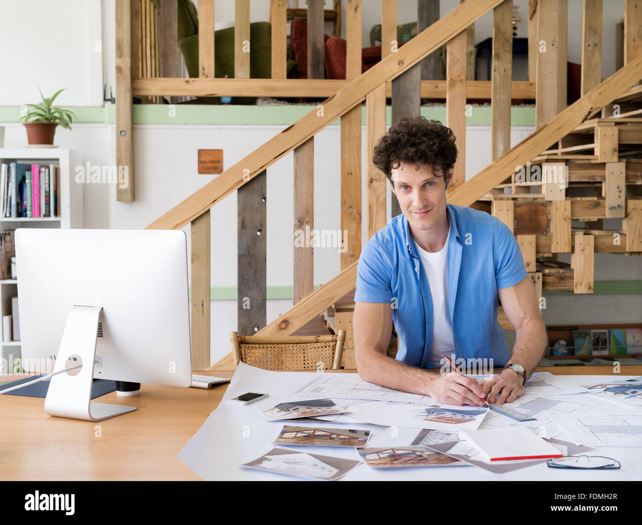 Man working with drafts in office Stock Photo - Alamy