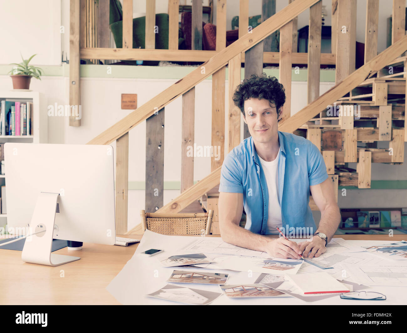 Man working with drafts in office Stock Photo - Alamy