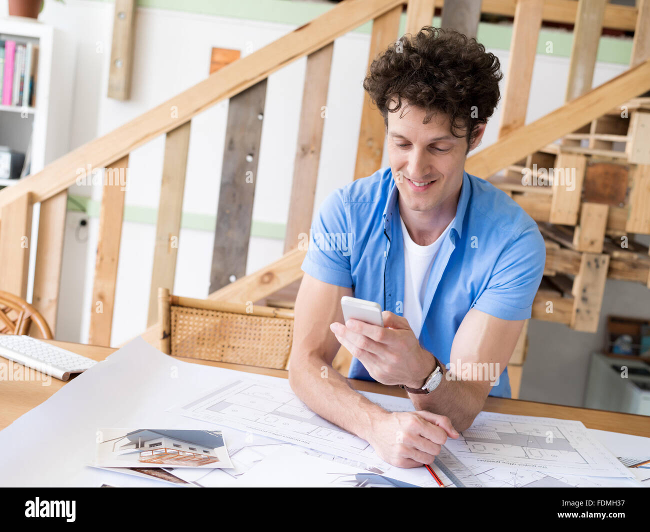 Man working with drafts in office Stock Photo - Alamy