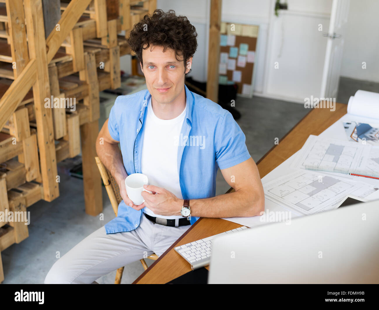 Man working with drafts in office Stock Photo - Alamy