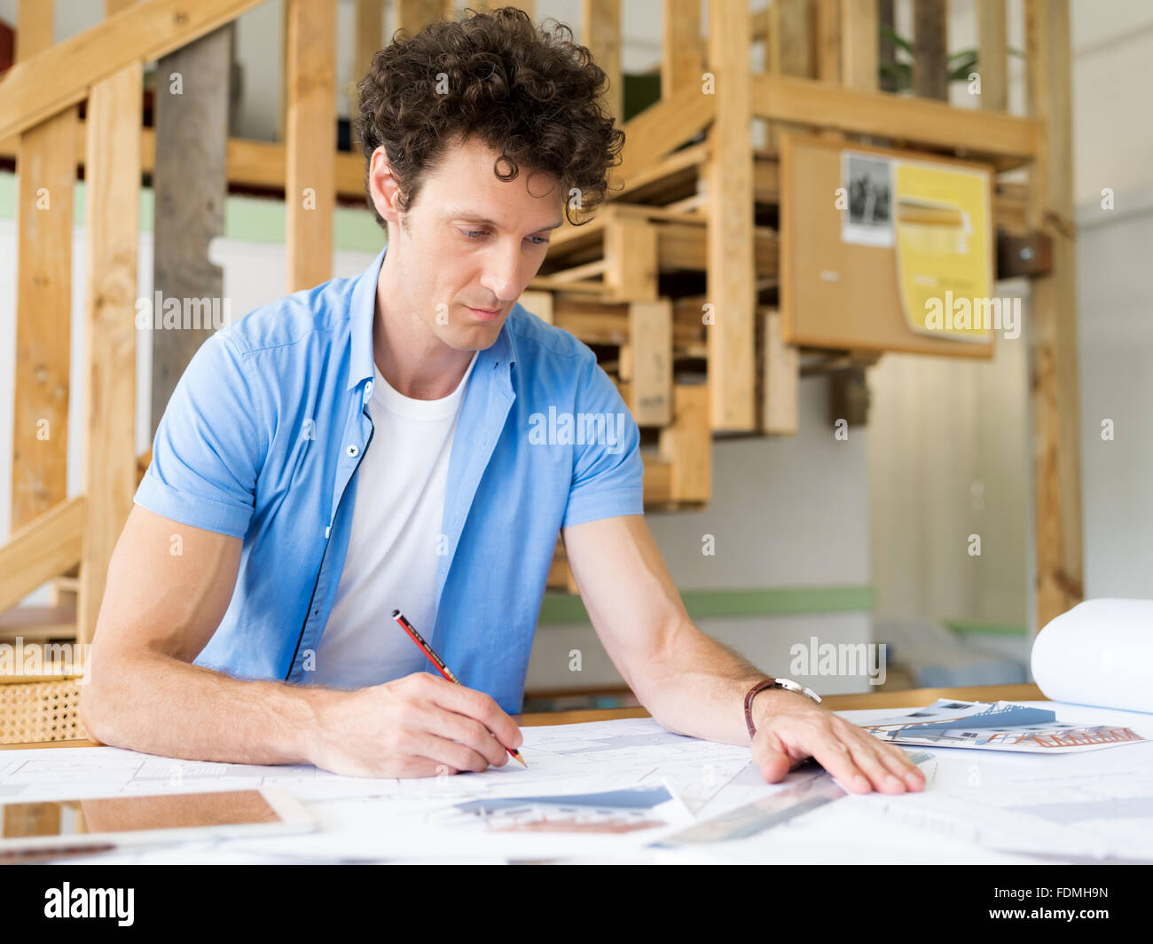 Man working with drafts in office Stock Photo - Alamy