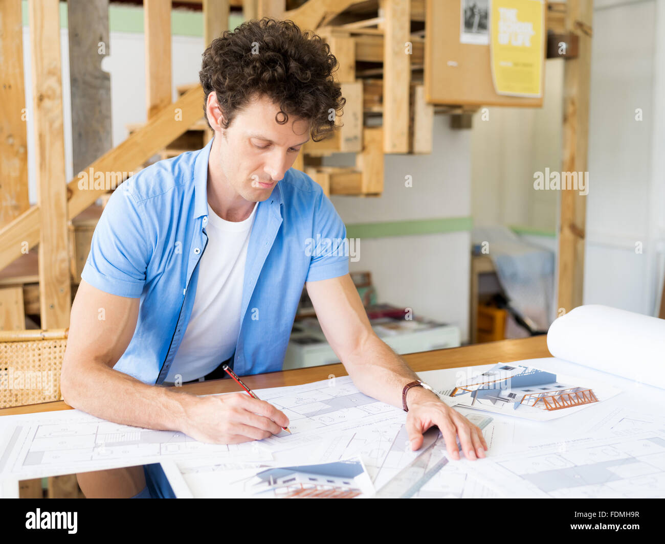 Man working with drafts in office Stock Photo - Alamy
