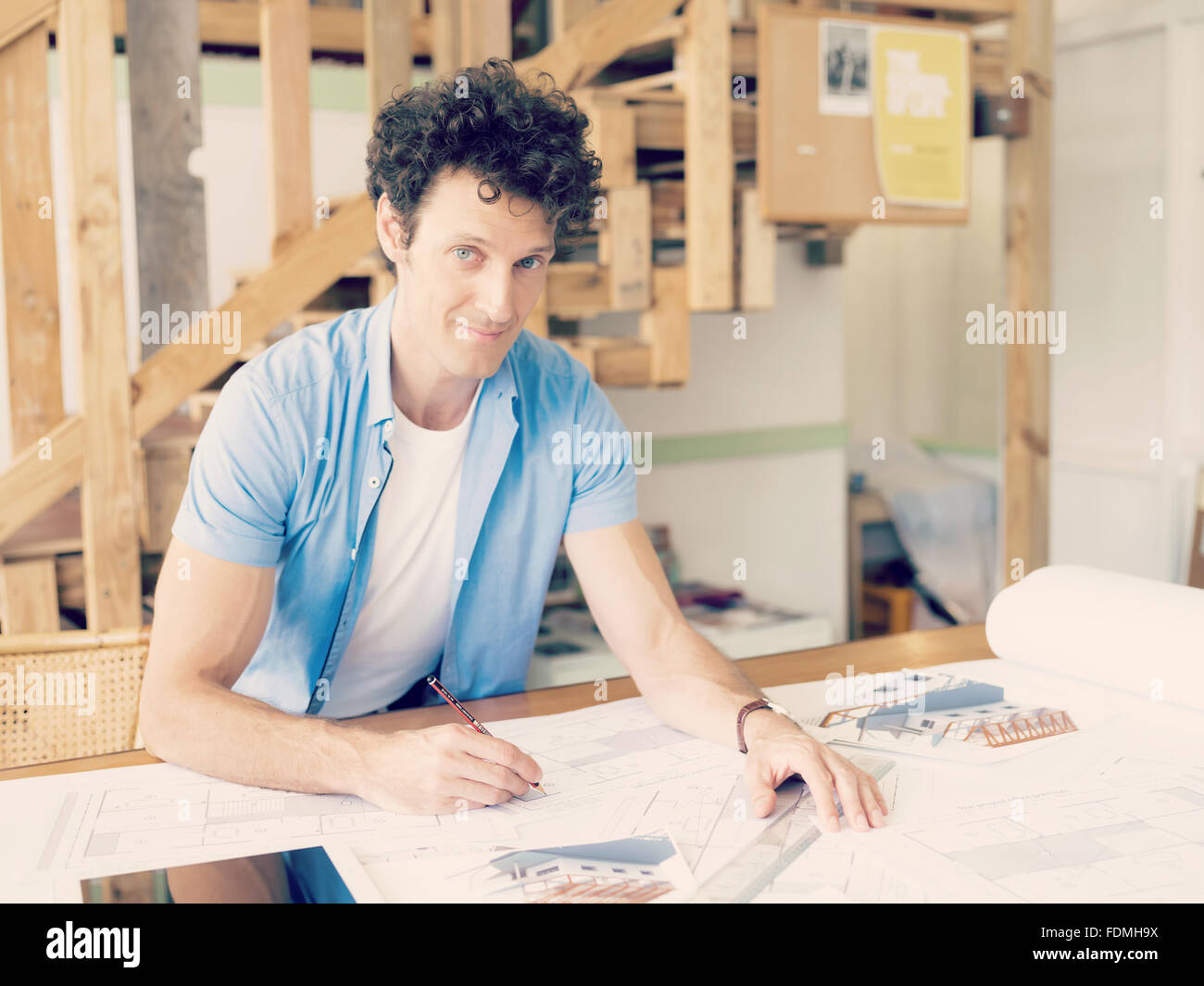 Man working with drafts in office Stock Photo - Alamy