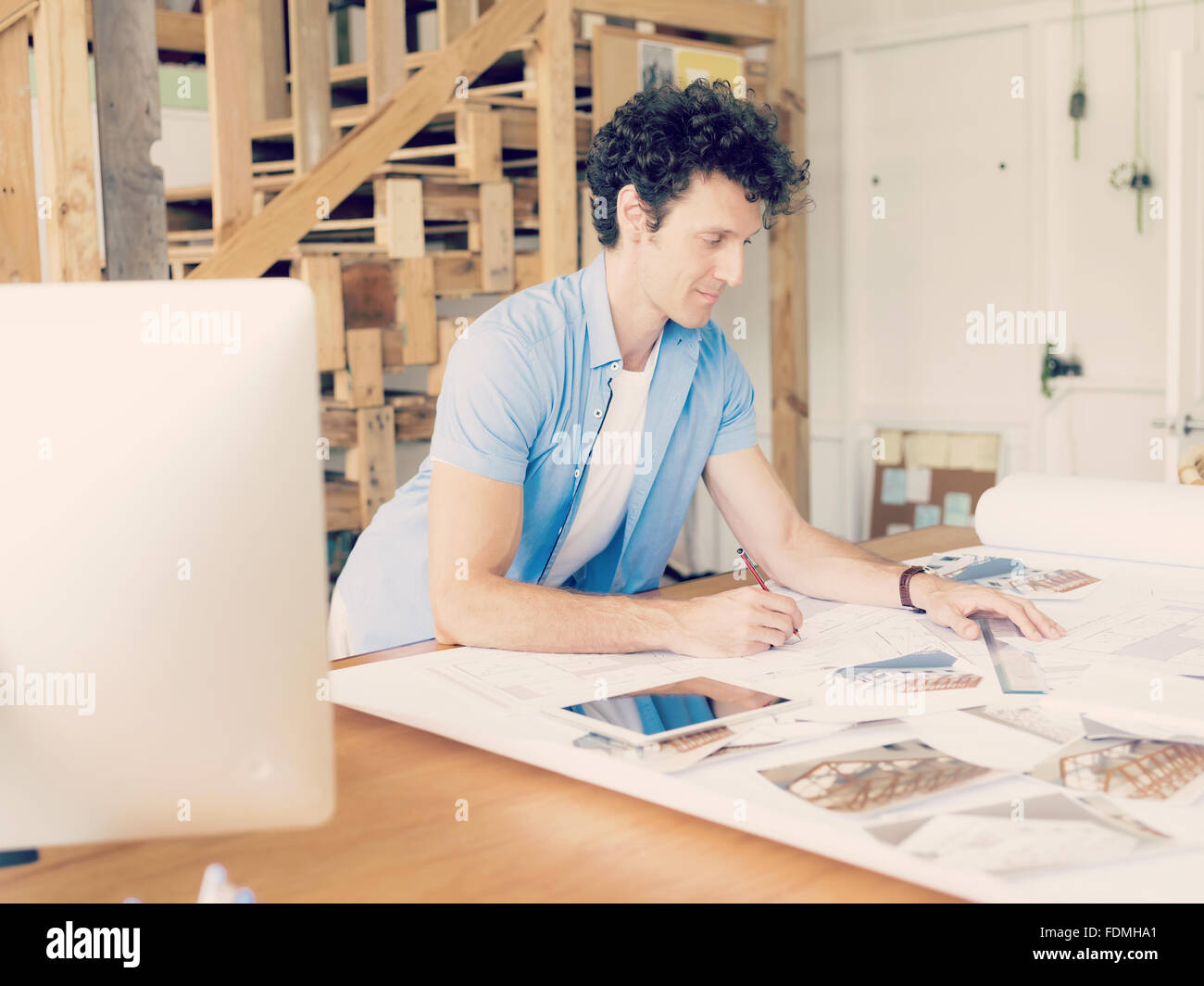 Man working with drafts in office Stock Photo - Alamy