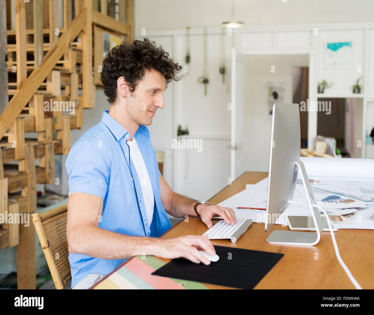 Man working at his desk in office Stock Photo - Alamy