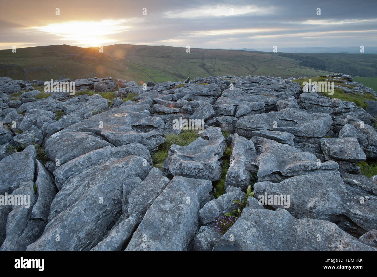 Dawn on the limestone escarpment above the village of Malham, Yorkshire ...