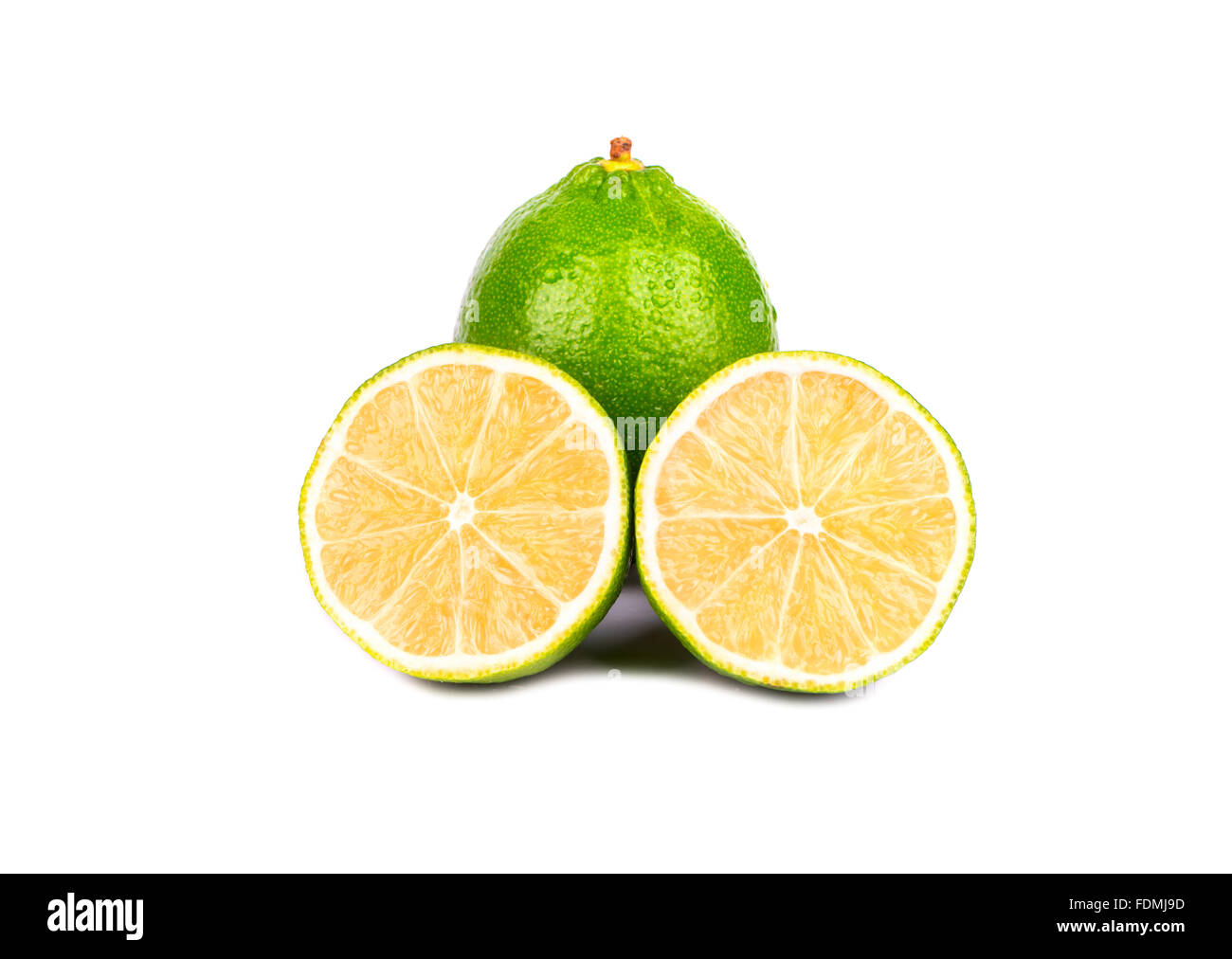 Fresh lime fruit with two halves on a white background Stock Photo - Alamy