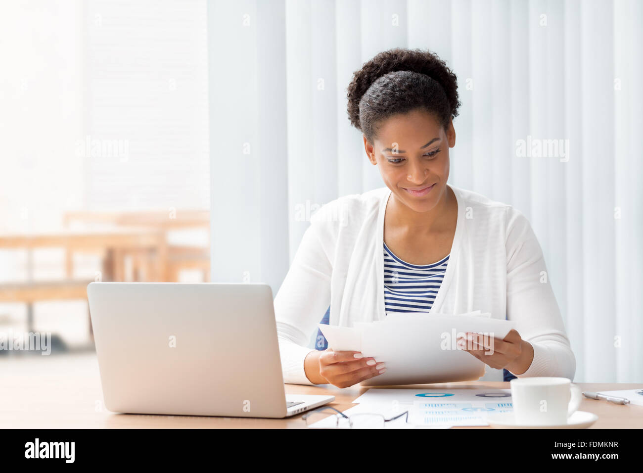 Businessowman working with papers in office Stock Photo - Alamy