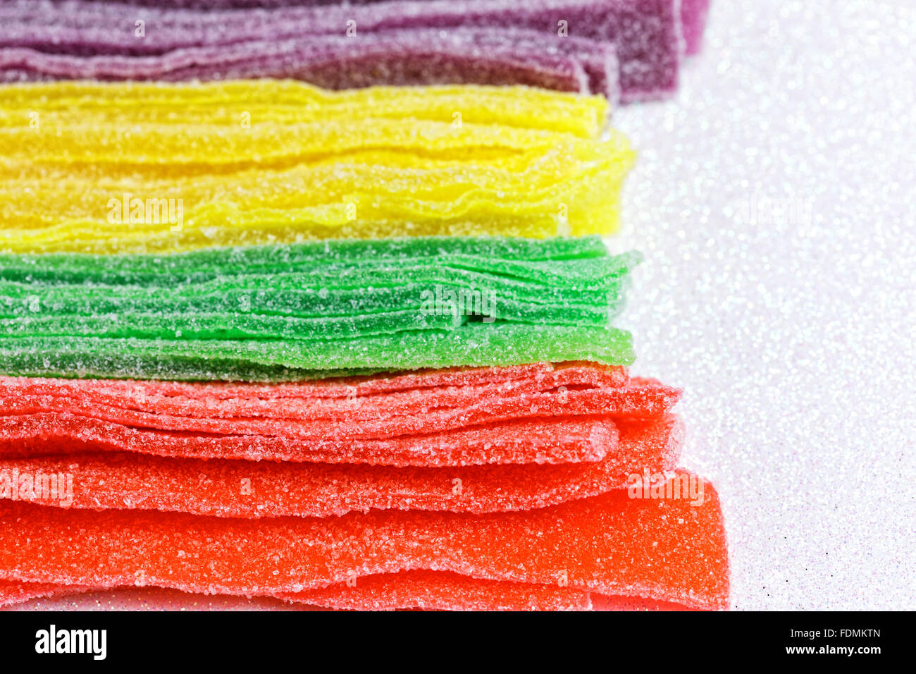 Colorful sugar jelly candy strip over white background Stock Photo - Alamy
