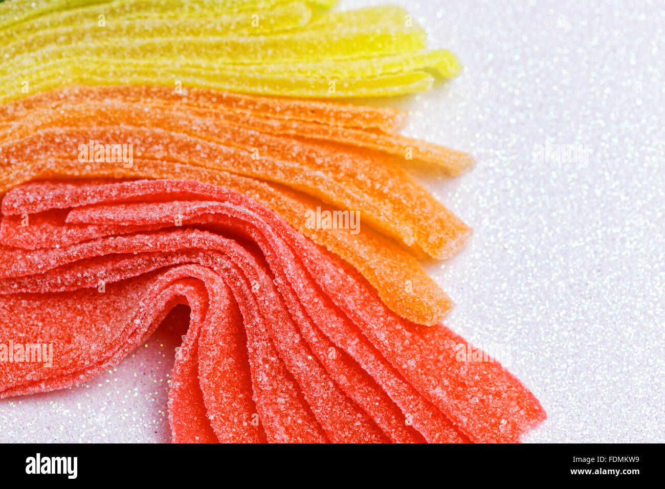 Colorful sugar jelly candy strip over white background Stock Photo - Alamy