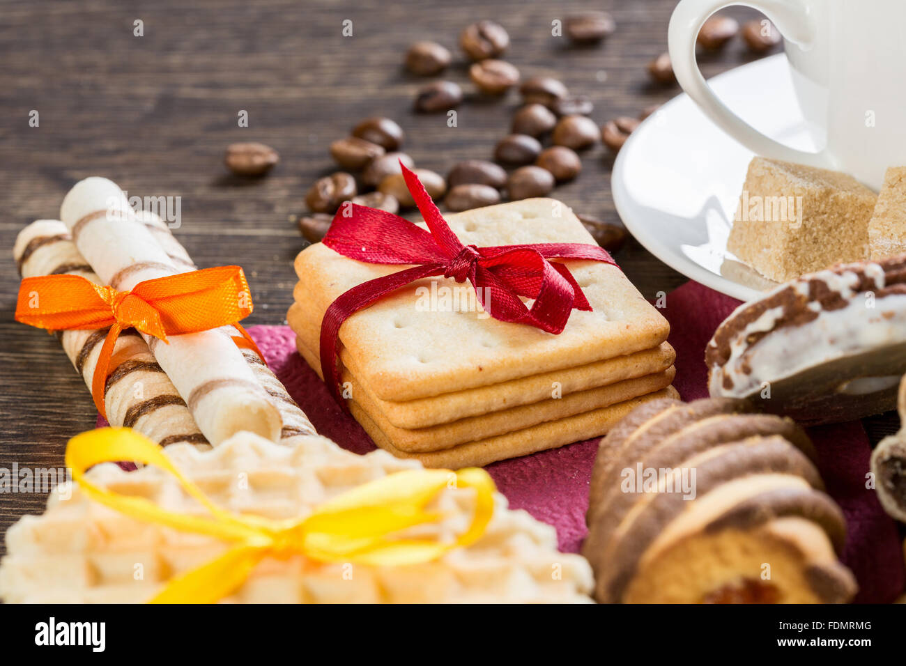 Assorted biscuits and sweets on table Stock Photo - Alamy