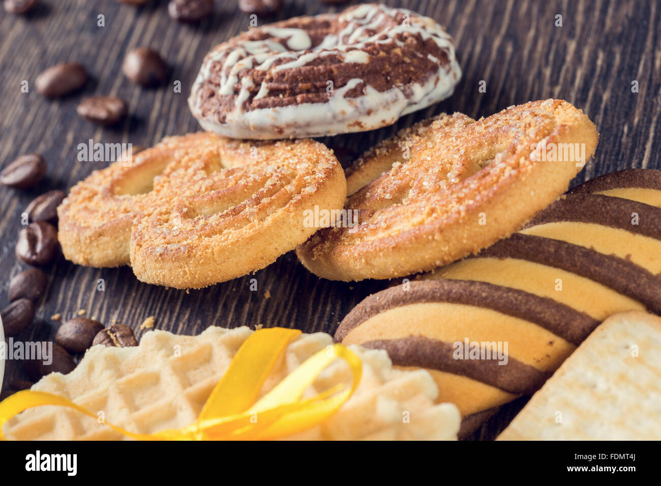 Assorted biscuits and sweets on table Stock Photo - Alamy