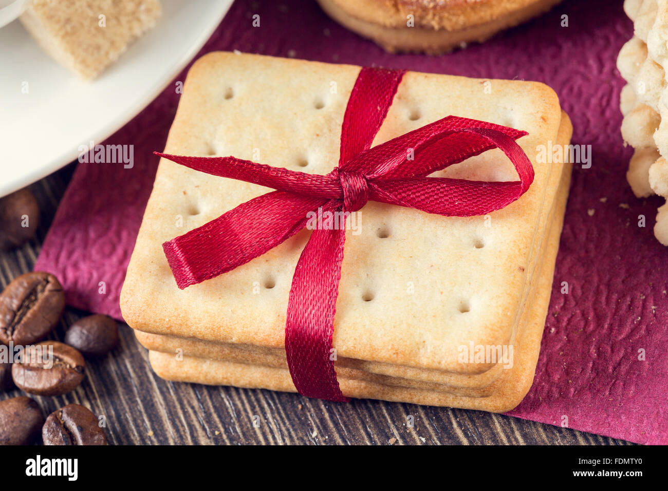 Assorted biscuits and sweets on table Stock Photo - Alamy