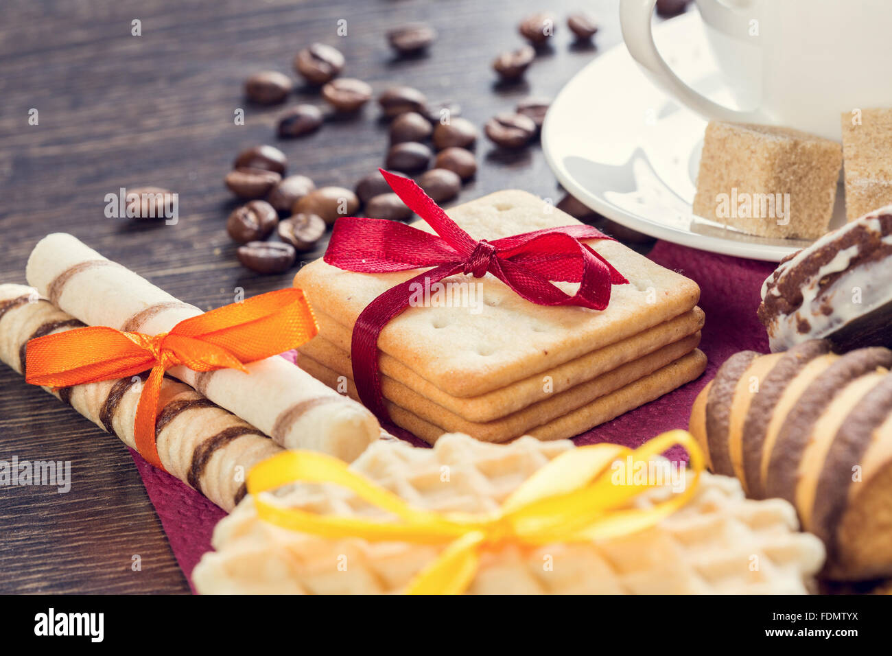 Assorted biscuits and sweets on table Stock Photo - Alamy