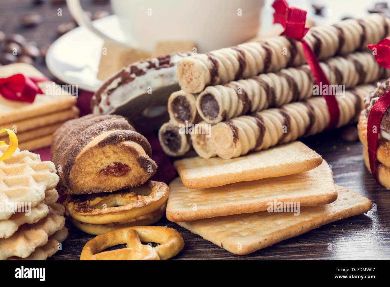 Assorted biscuits and sweets on table Stock Photo - Alamy