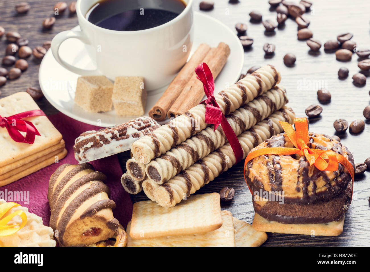 Assorted biscuits and sweets on table Stock Photo - Alamy