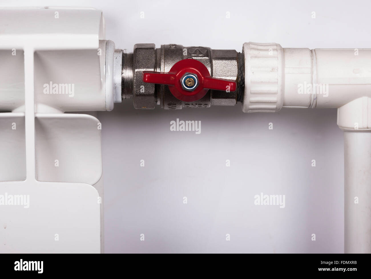 White radiator convector in an apartment faucet valve Stock Photo - Alamy