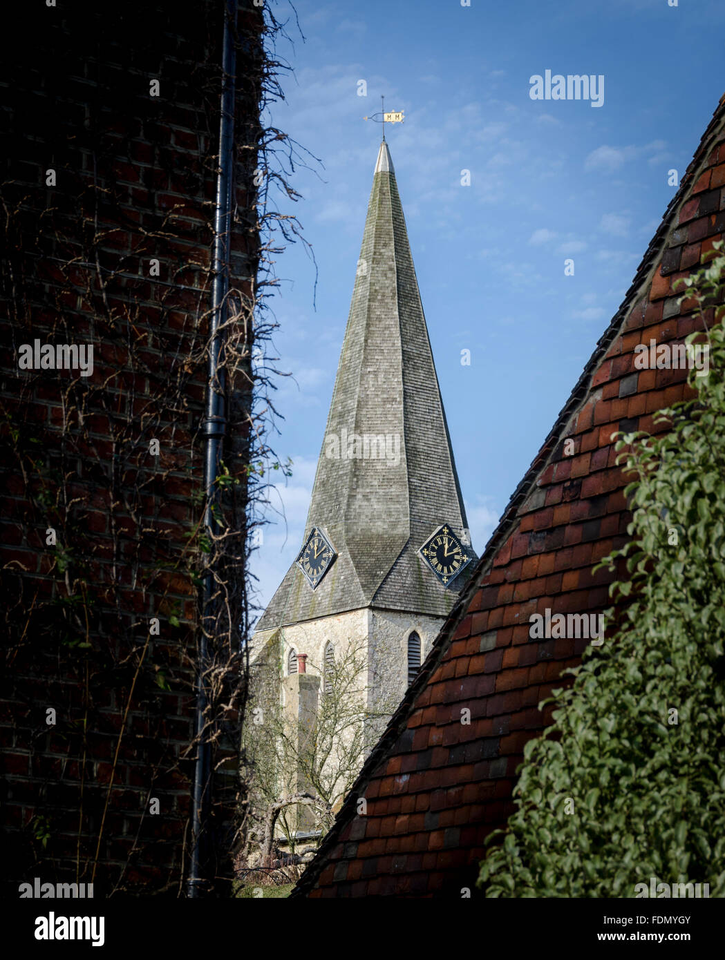 View of the church tower and clock in the village of Woodchurch, Kent ...