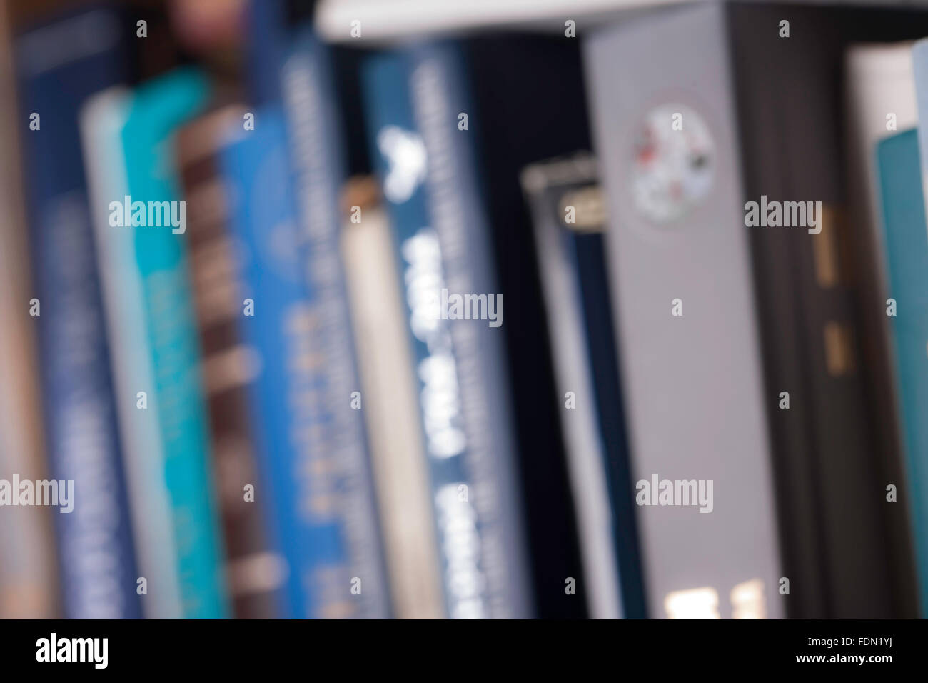blurred image of books on a shelf Stock Photo - Alamy