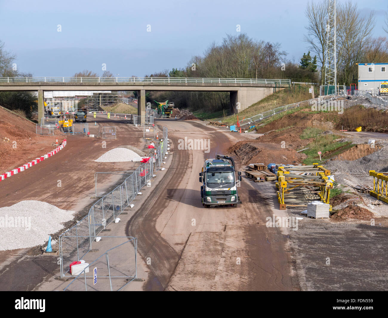 Road sweeper on a construction site of a new road layout being built ...