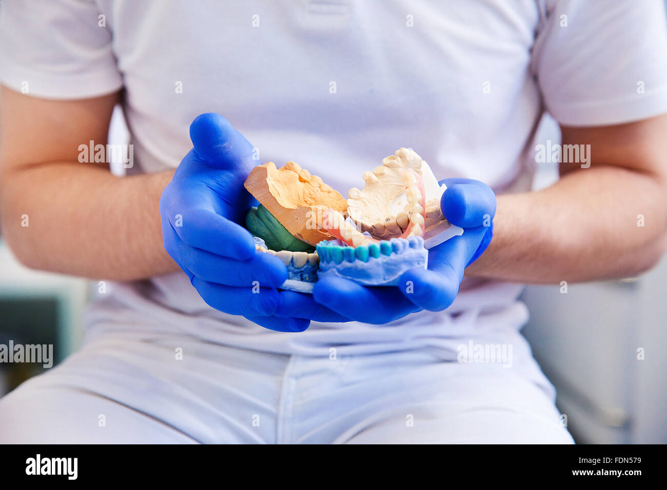 dentist treats teeth, doctor and reanimation Stock Photo - Alamy