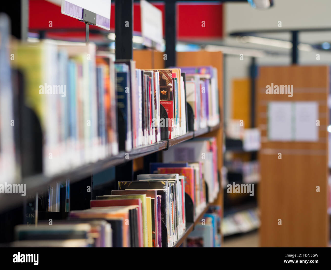 Interior of library with book shelves with books Stock Photo - Alamy