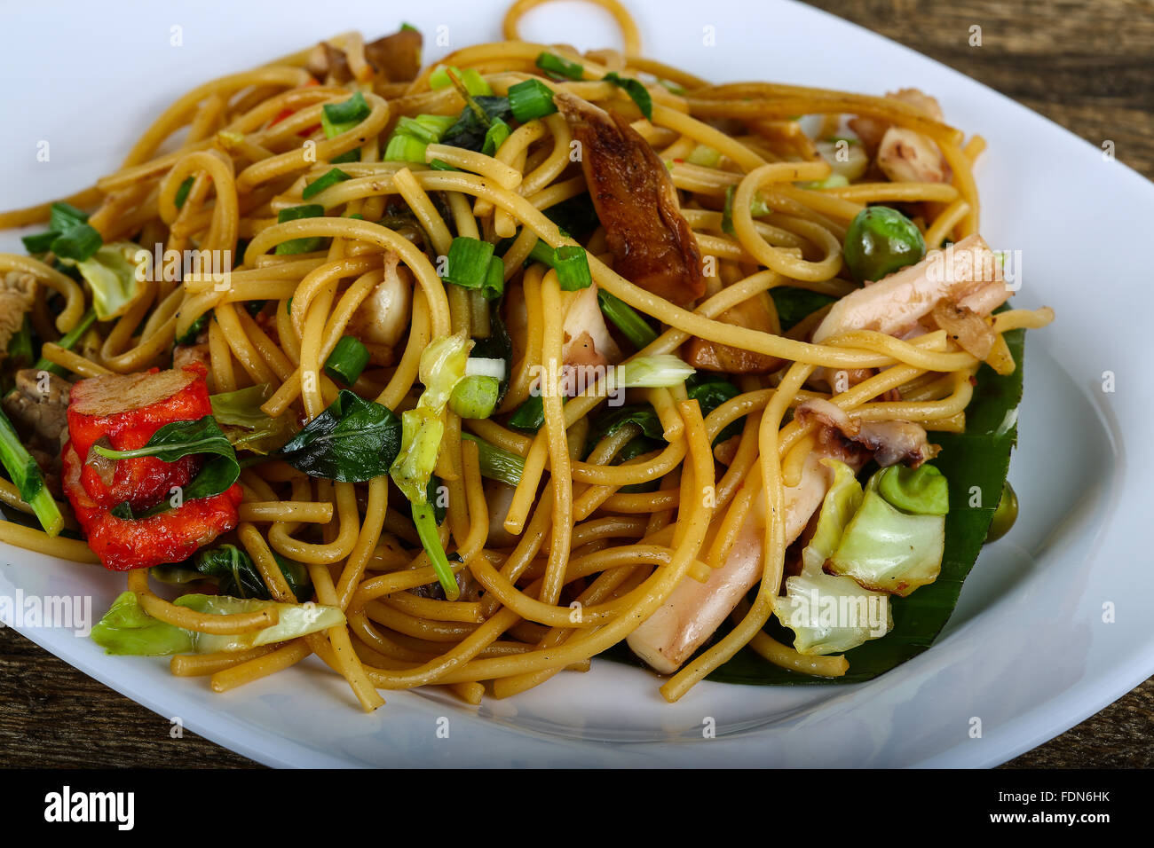 Asian style pasta with seafood on banana leaf Stock Photo - Alamy